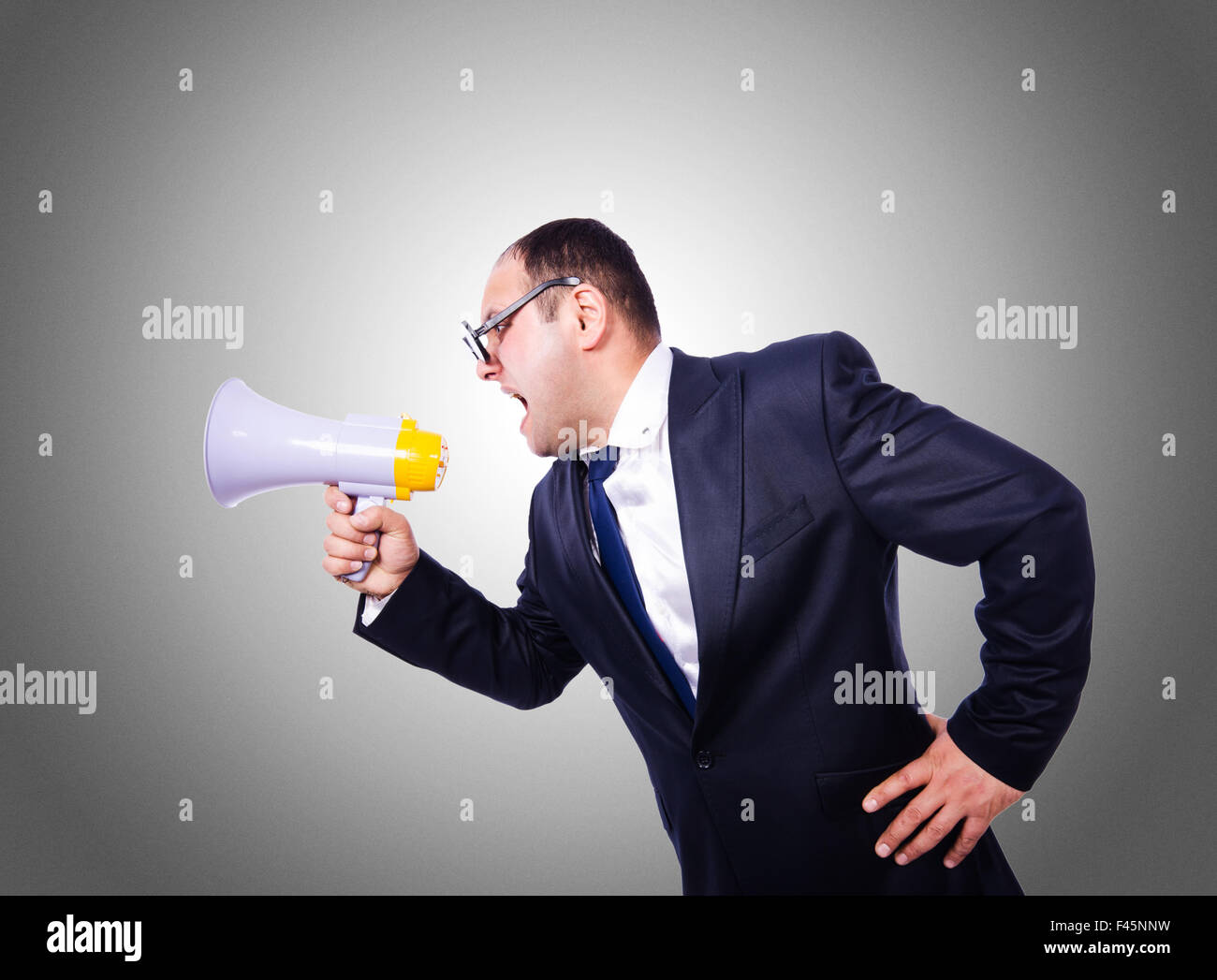 Funny man with loudspeaker on white Stock Photo - Alamy