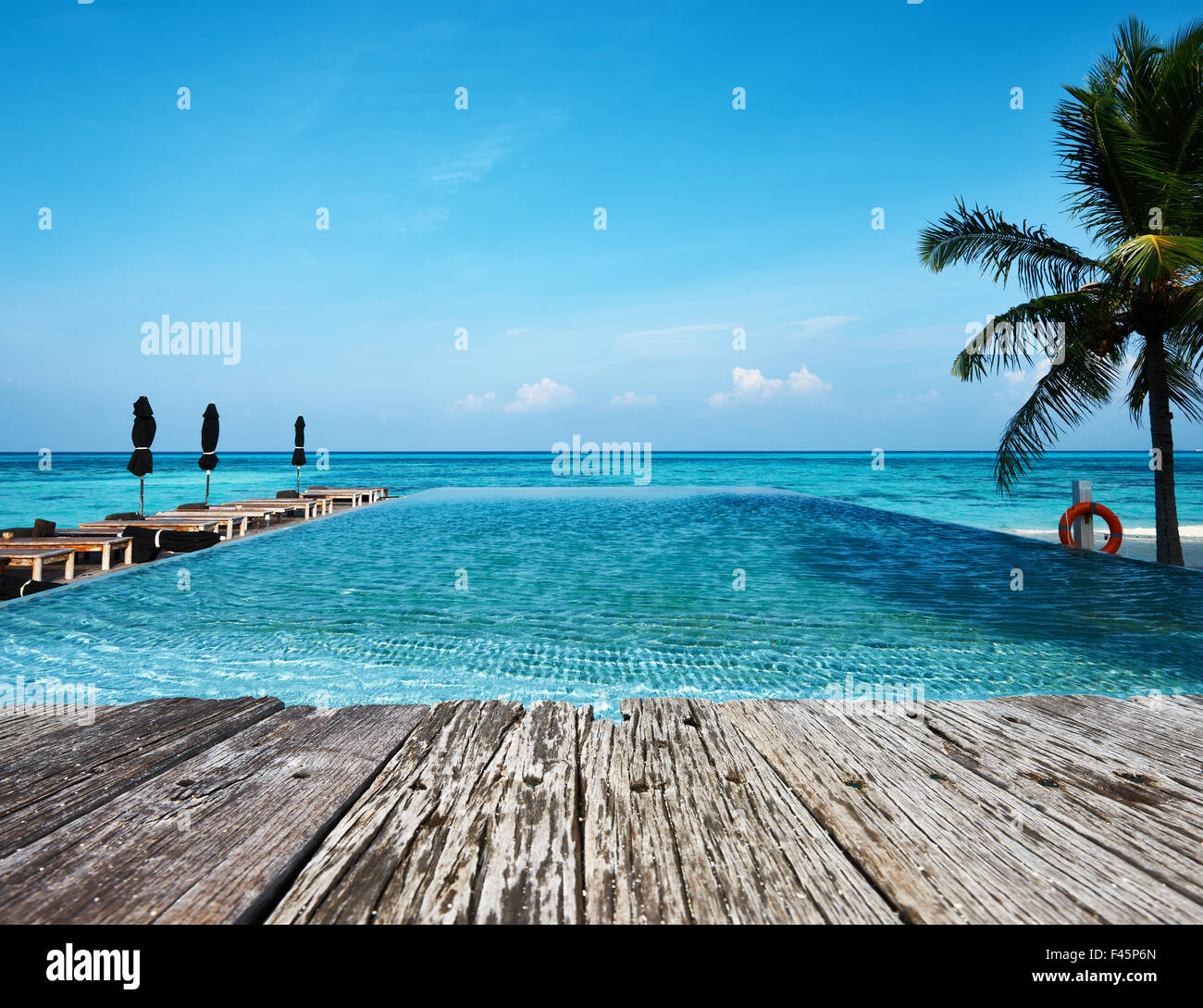 Swimming pool and old wooden pier Stock Photo - Alamy