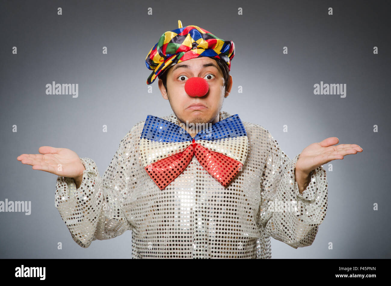 Funny clown against dark background Stock Photo - Alamy