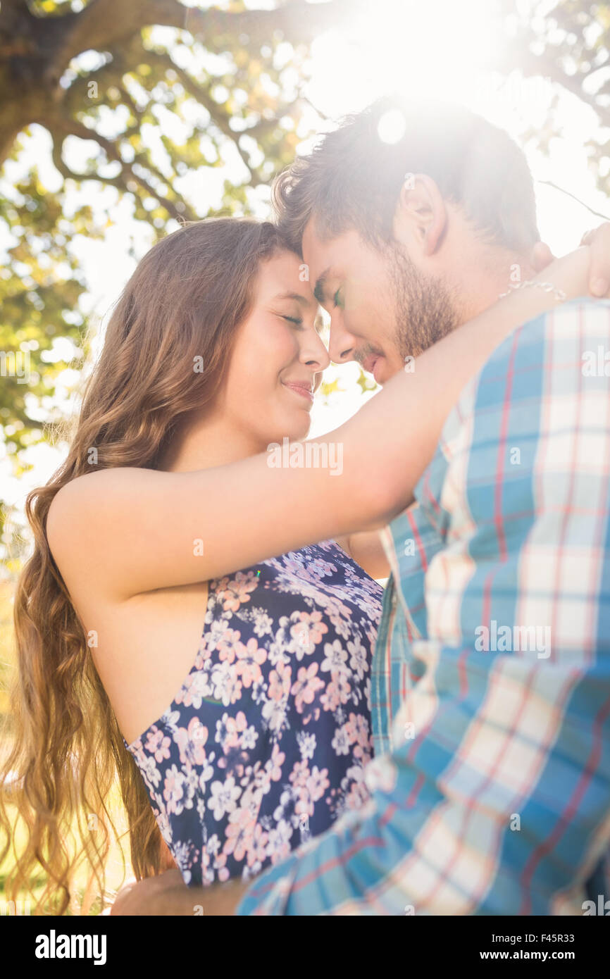 Cute couple hugging in the park Stock Photo - Alamy