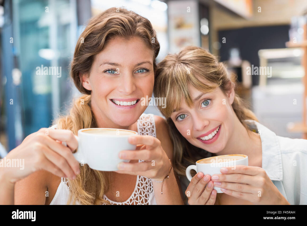 Beautiful women drinking coffee hi-res stock photography and images - Alamy