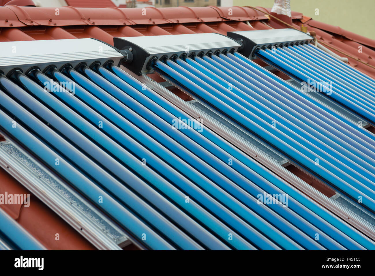Vacuum collectors- solar water heating system Stock Photo - Alamy