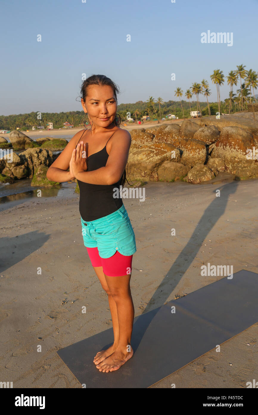 Beautiful woman doing yoga meditating hi-res stock photography and ...
