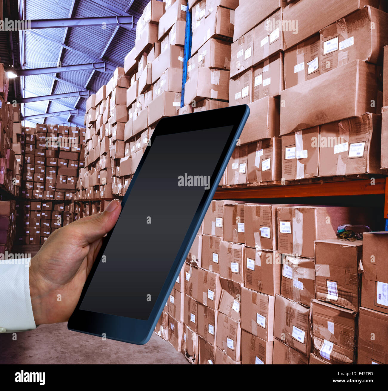 Composite image of man using tablet pc Stock Photo - Alamy