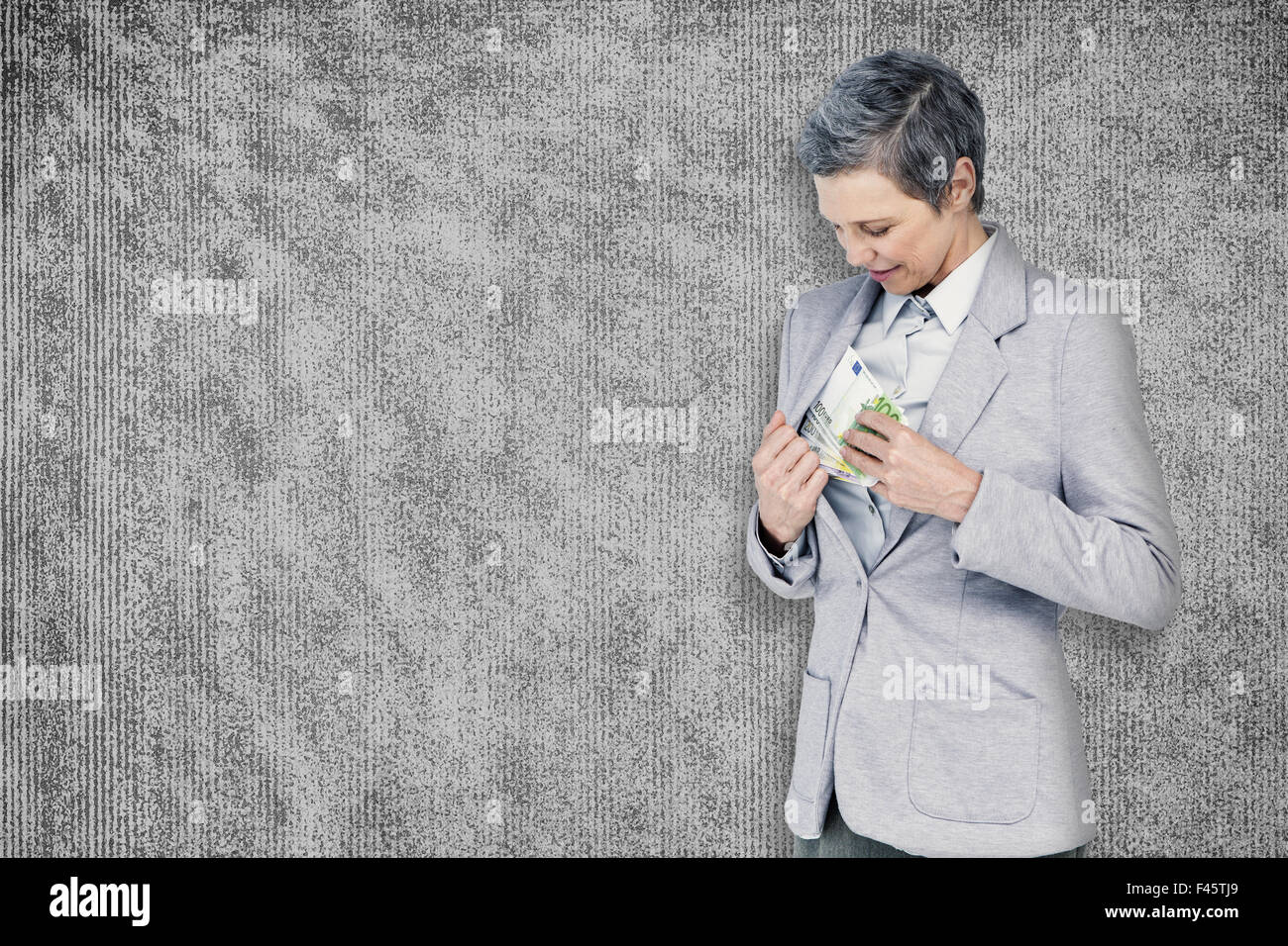 Composite image of businesswoman taking bribe Stock Photo - Alamy