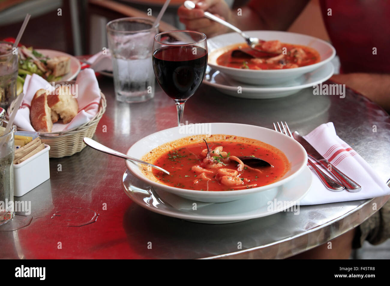 Fish soup with tomatoes and mussels Stock Photo - Alamy