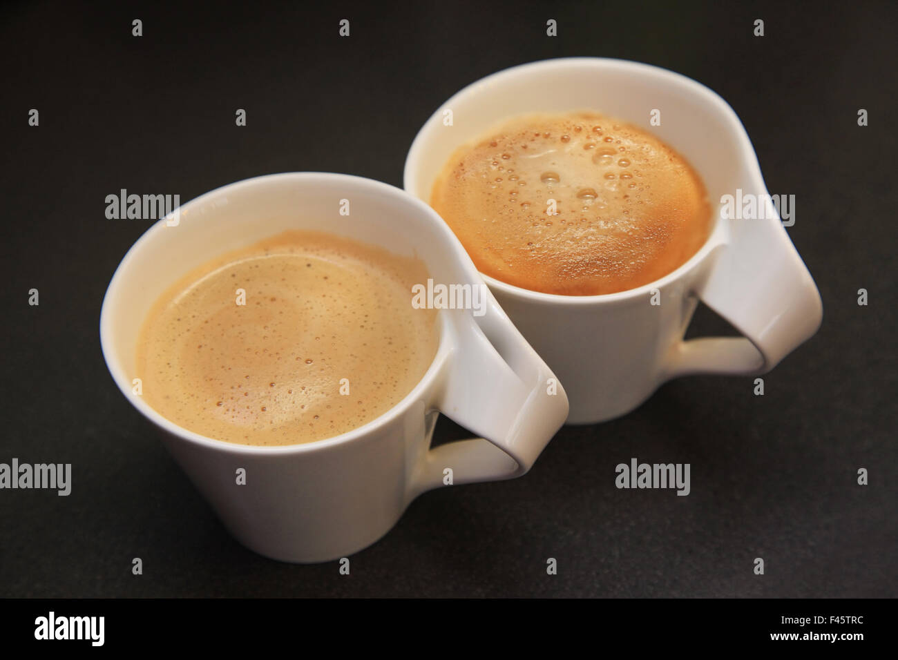 Two cups coffee latte froth hi-res stock photography and images - Alamy