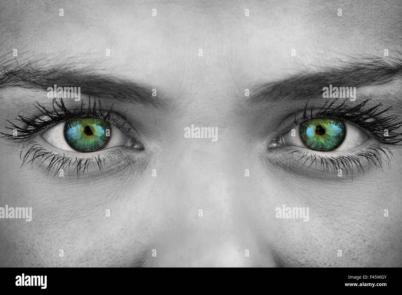 Composite image of blue eyes on grey face Stock Photo - Alamy