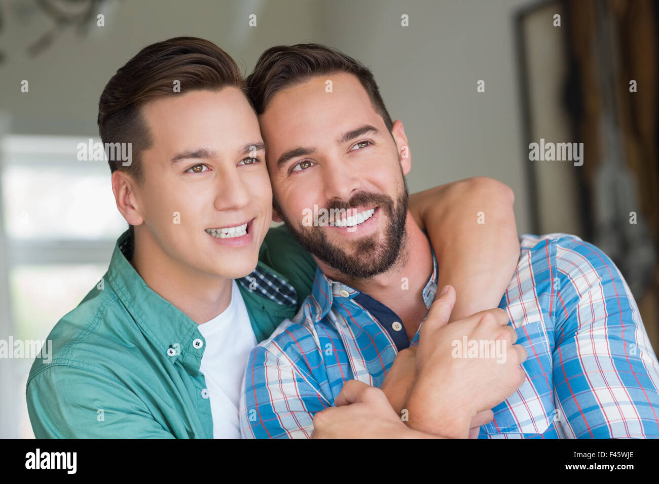 Homosexual couple men looking away Stock Photo - Alamy