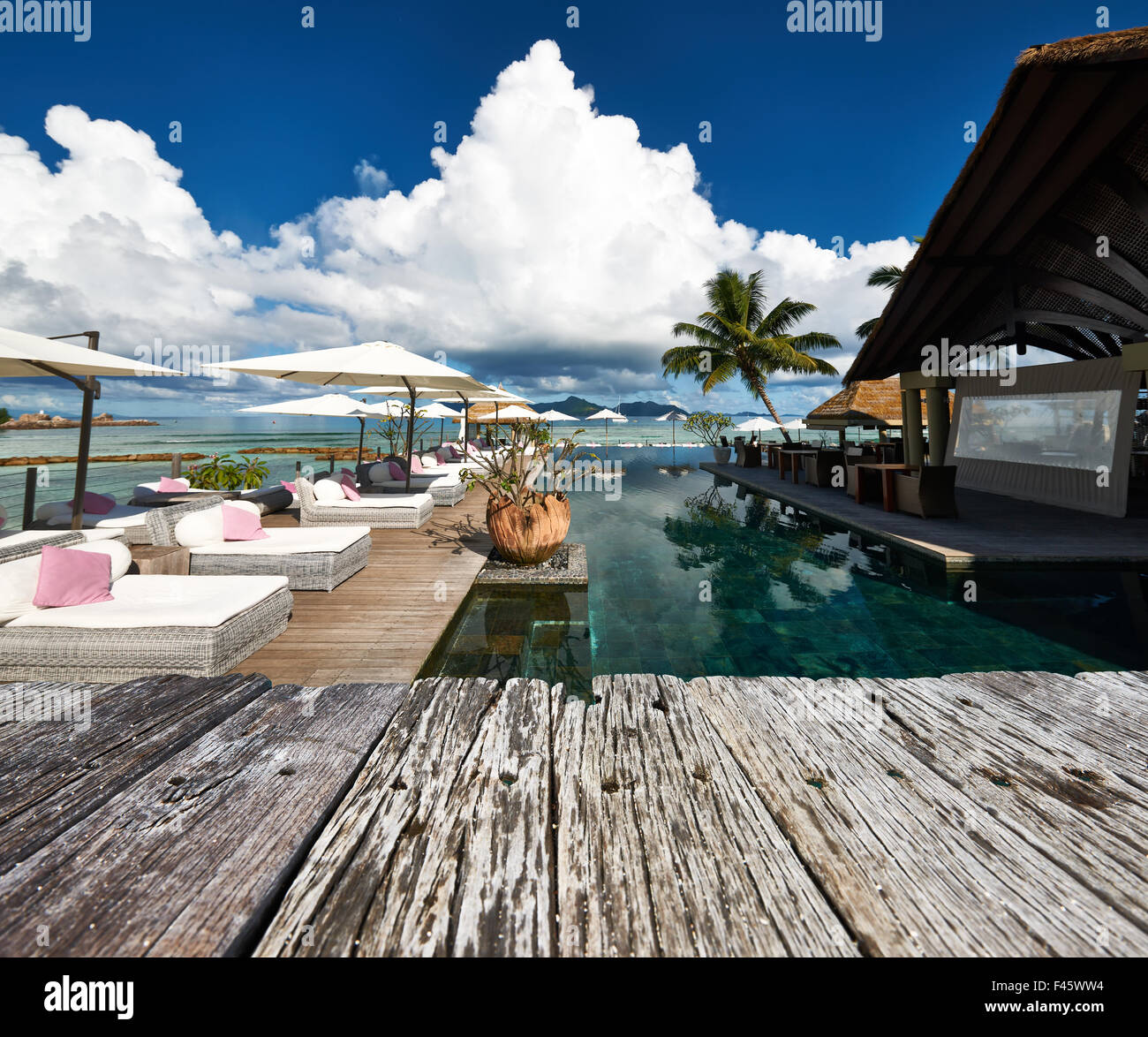 Luxury poolside jetty Stock Photo - Alamy