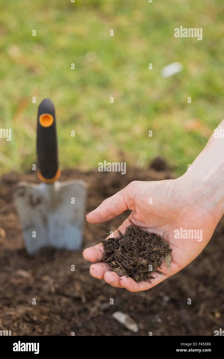 Woman planting in a field Stock Photo - Alamy