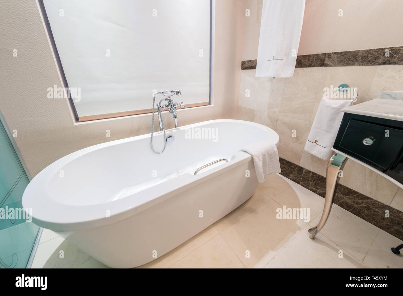 Modern bathroom interior with bathtub Stock Photo - Alamy