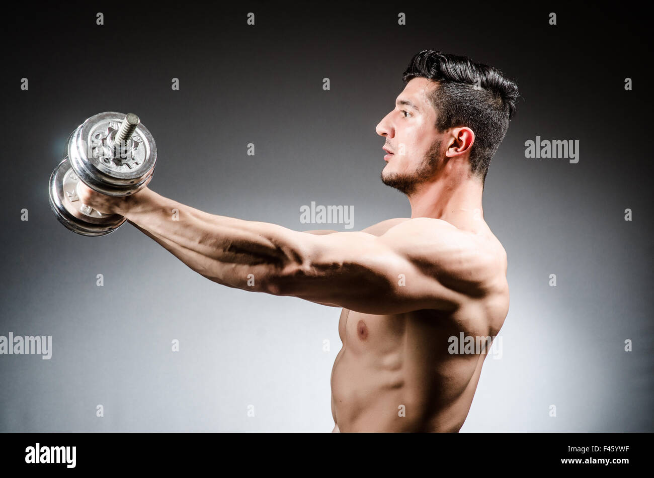 Muscular ripped bodybuilder with dumbbells Stock Photo - Alamy