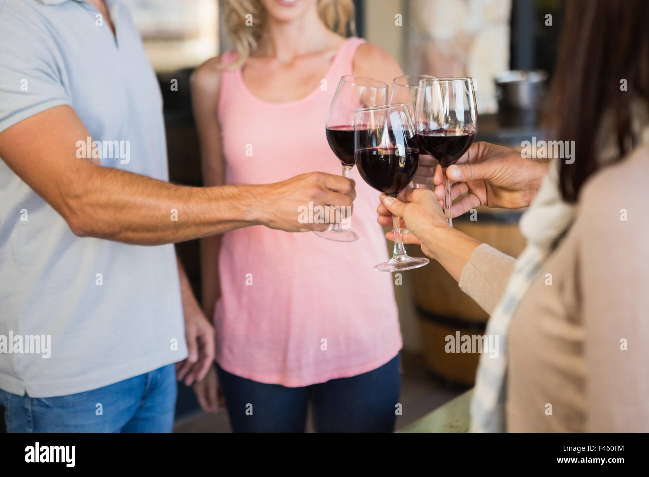 Happy friends in a wine tasting having wine Stock Photo - Alamy