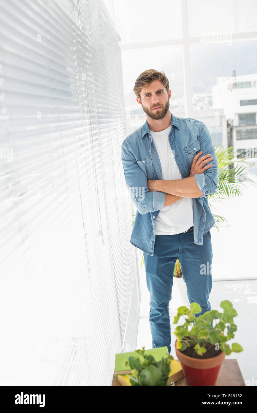 Smiling casual businessman standing and posing Stock Photo - Alamy
