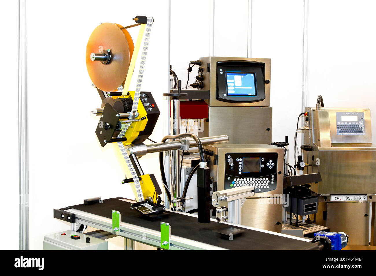 Sticker line machine Stock Photo - Alamy