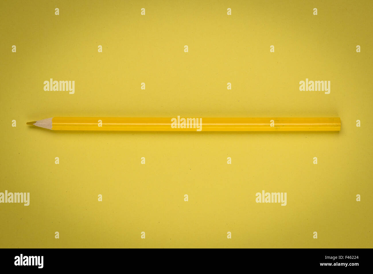 yellow pencil on yellow paper Stock Photo - Alamy