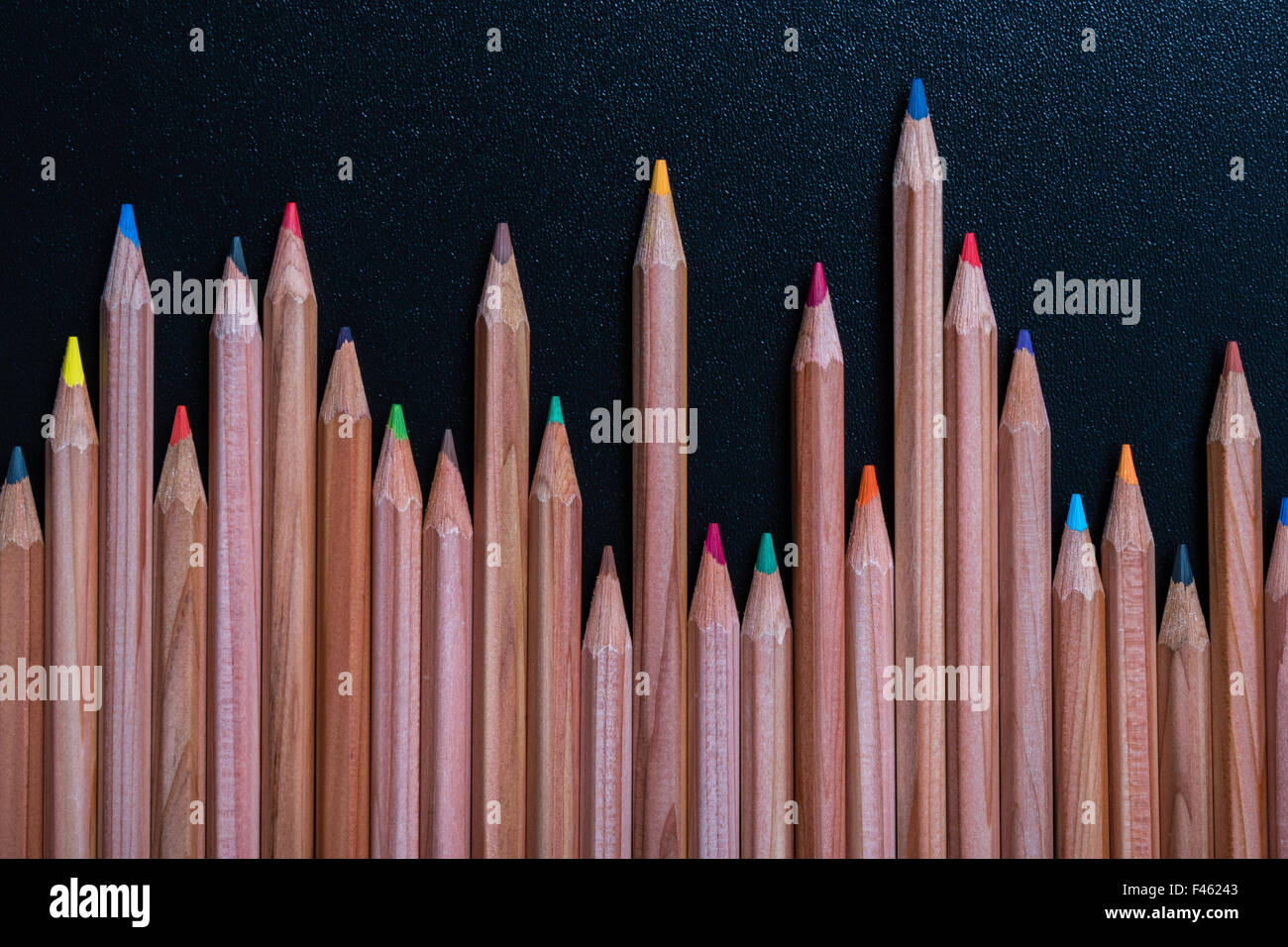 color pencils on black table Stock Photo - Alamy