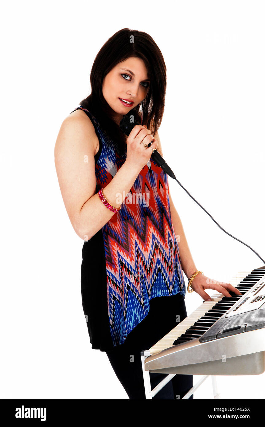 Woman playing on keyboard Stock Photo - Alamy