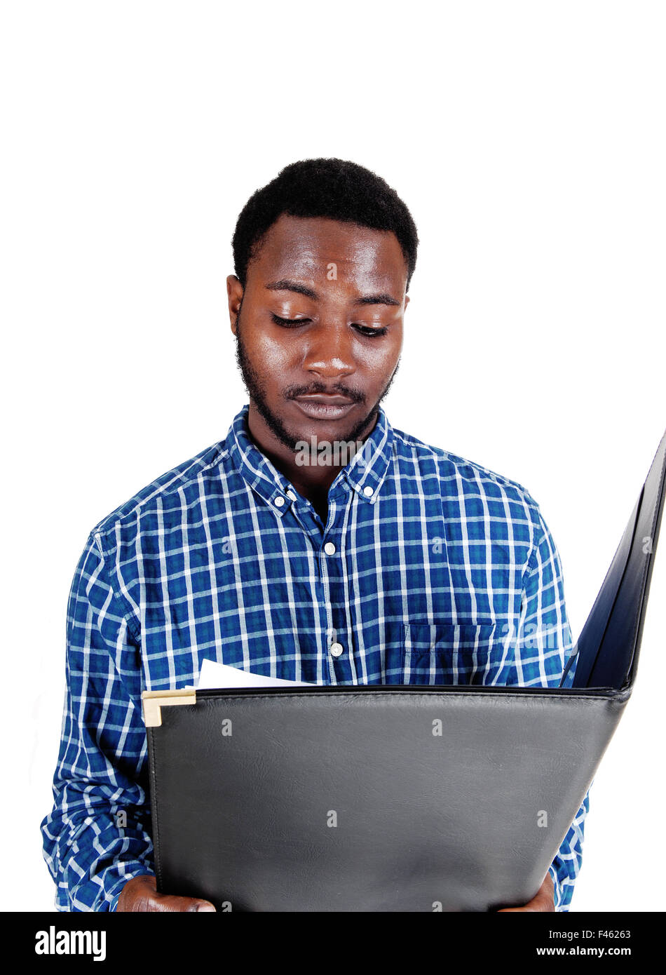 Black man reading paper Stock Photo - Alamy