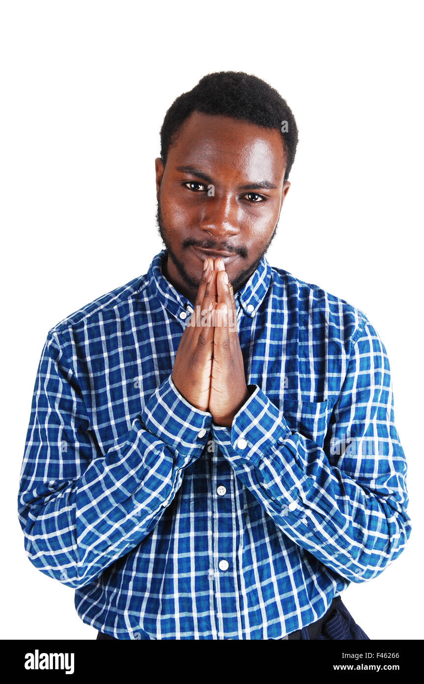 Black man praying Stock Photo - Alamy