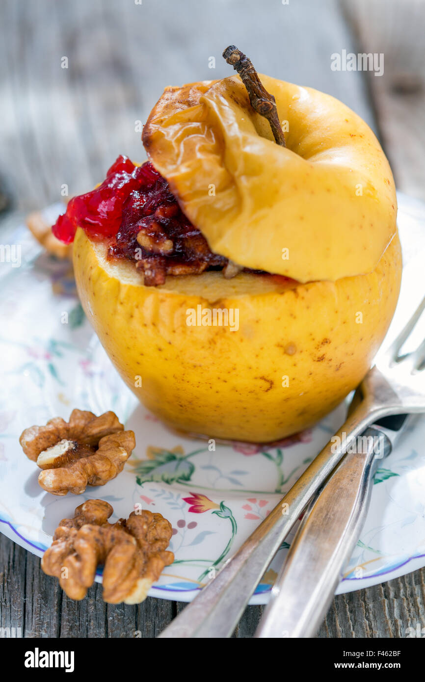 Baked apple with nuts closeup Stock Photo - Alamy