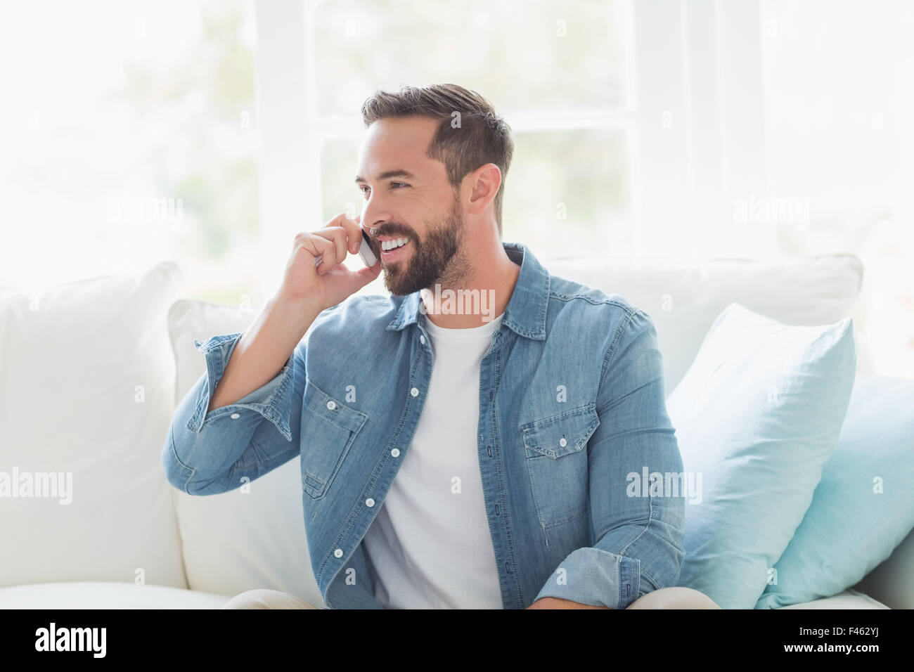 Smiling man on the phone Stock Photo - Alamy