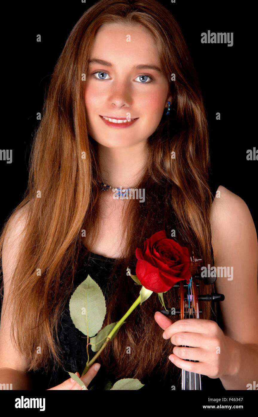 Standing woman with rose Stock Photo - Alamy