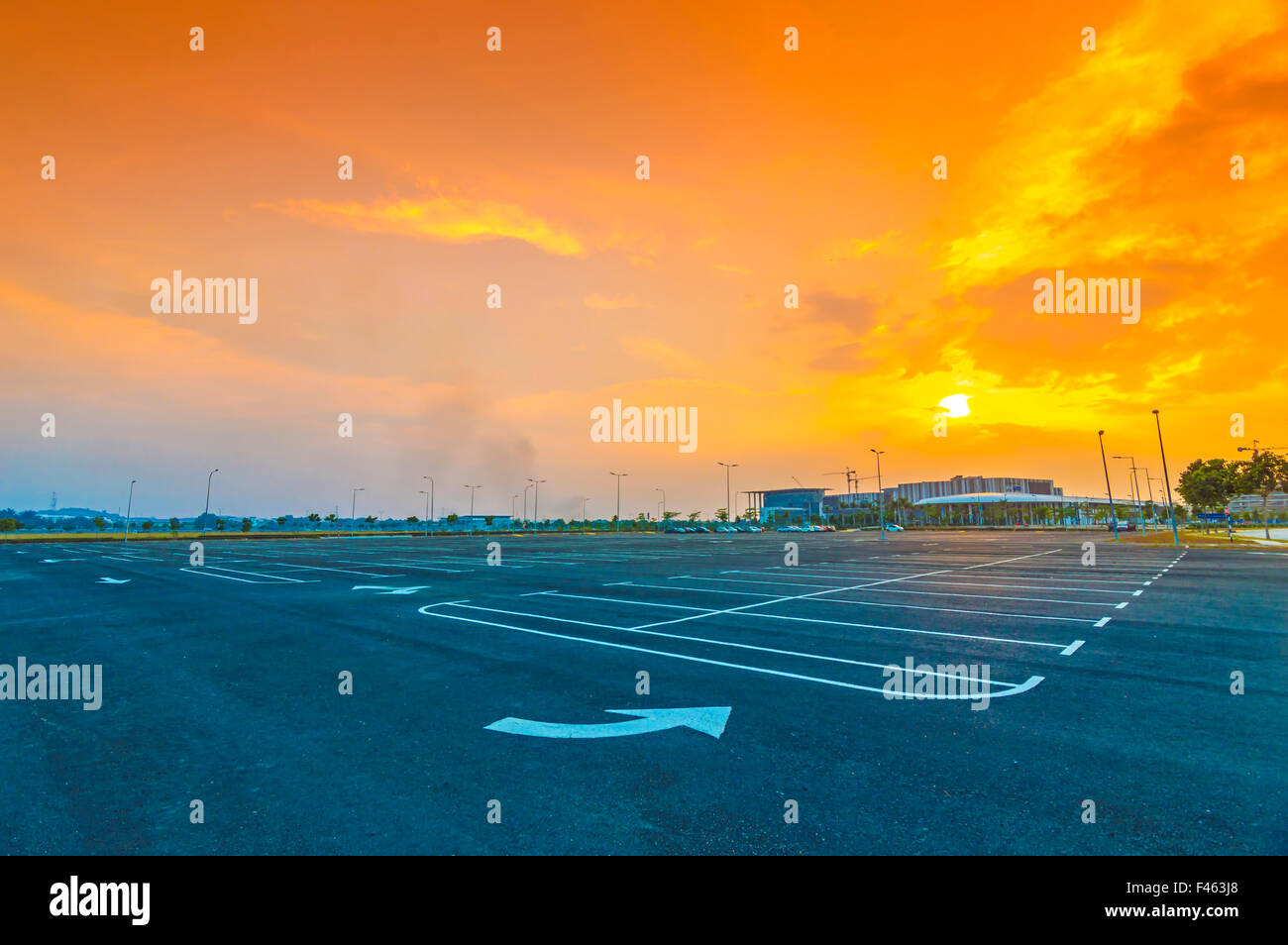 Sunset at empty parking lot Stock Photo - Alamy