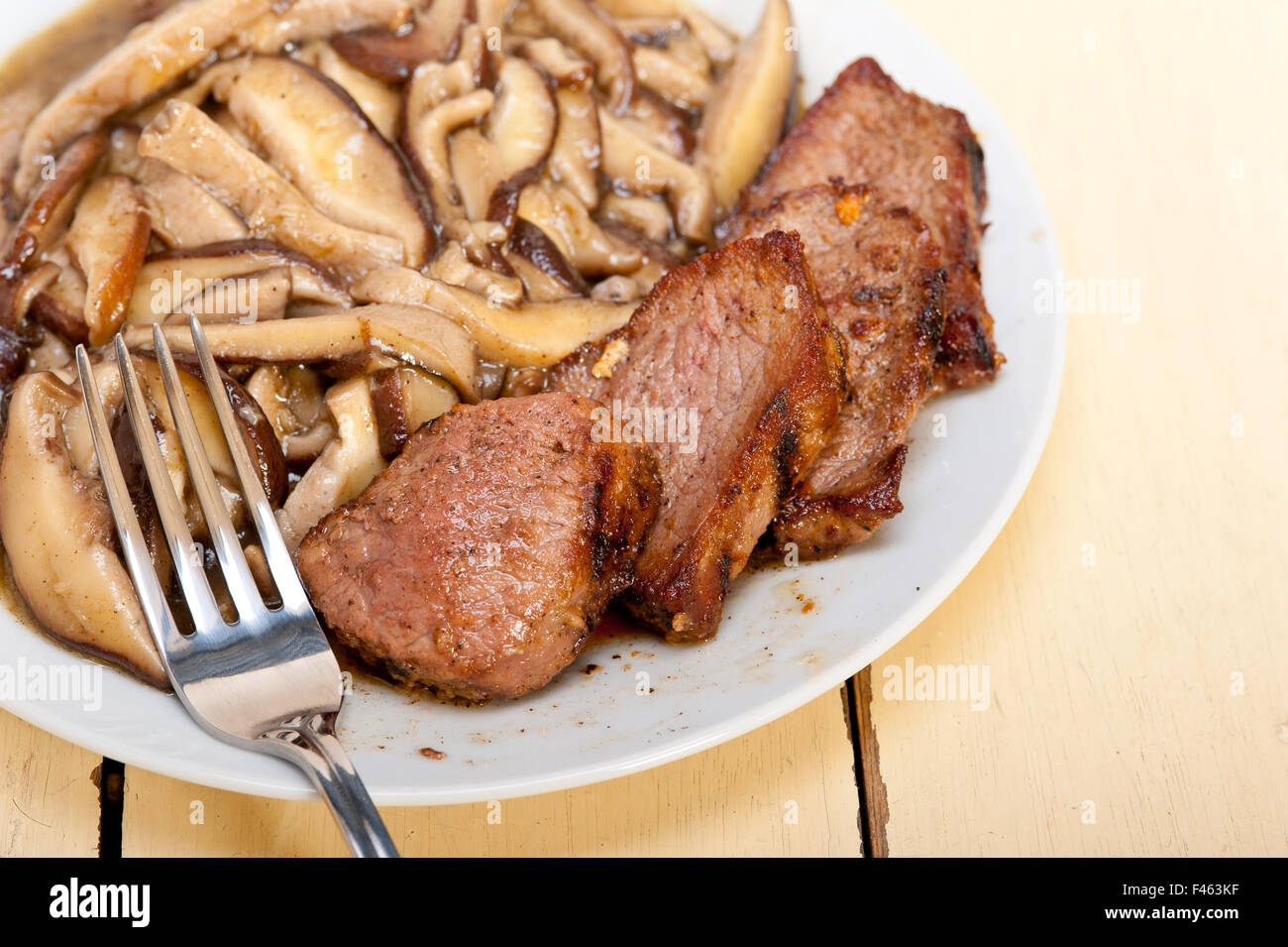 venison deer game filet and wild mushrooms Stock Photo - Alamy