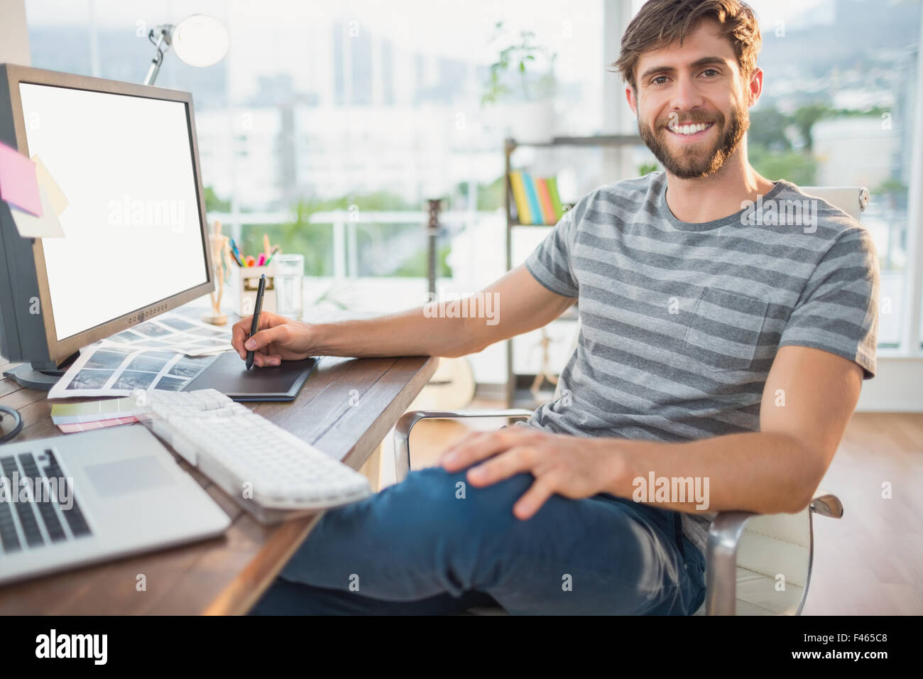 Graphic designer using a graphics tablet Stock Photo - Alamy