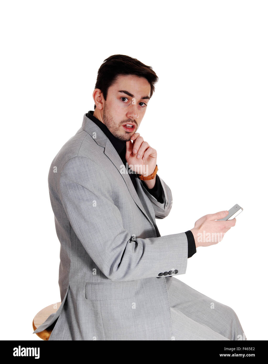Young man holding cell phone Stock Photo - Alamy