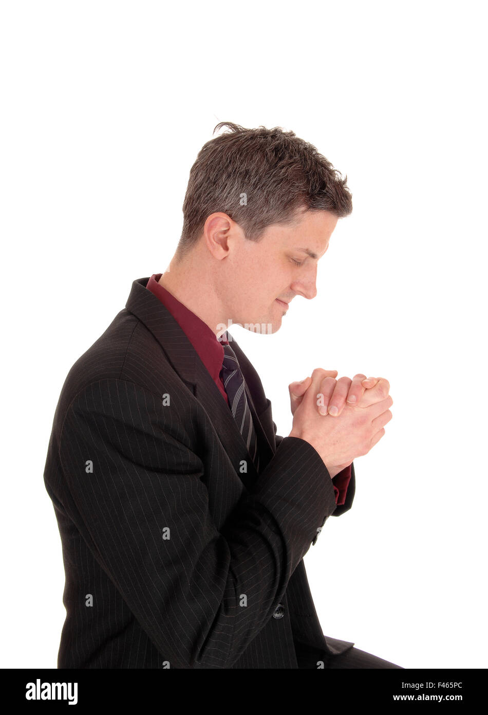 Praying man suit hi-res stock photography and images - Alamy
