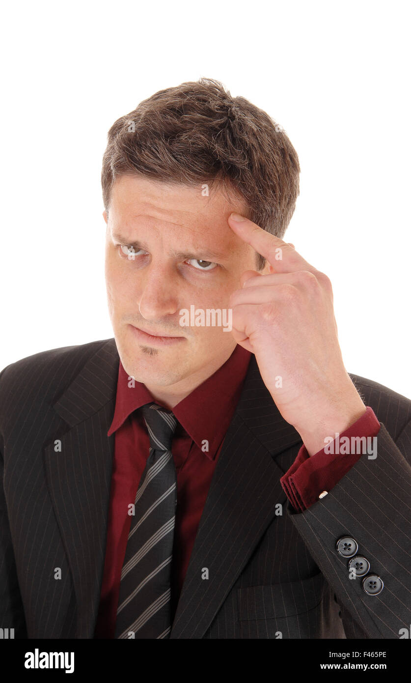 Man with finger on forehead Stock Photo - Alamy
