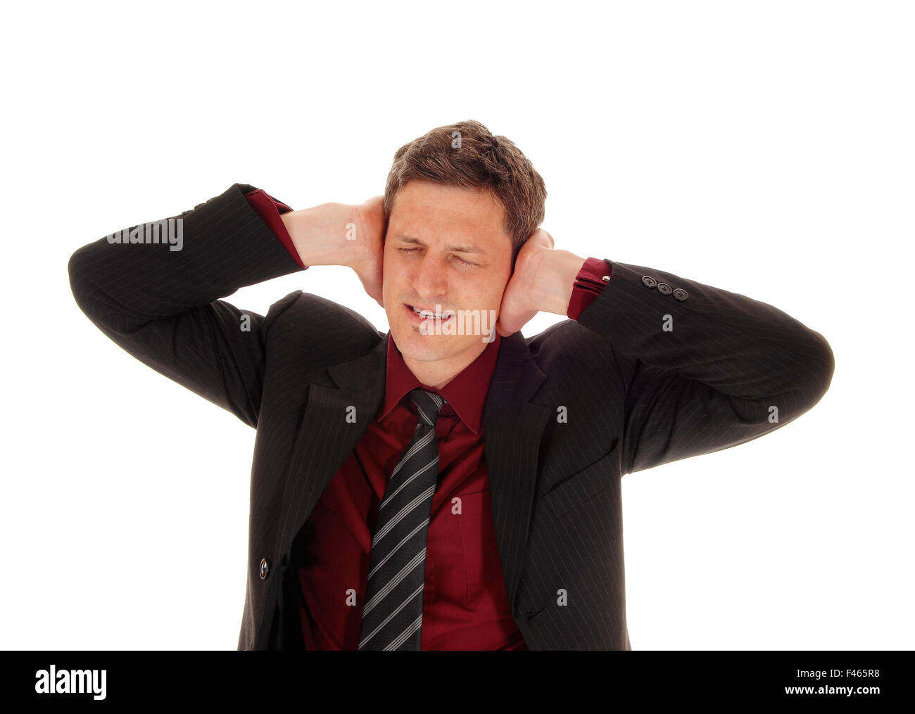 Man covering his ear's Stock Photo - Alamy