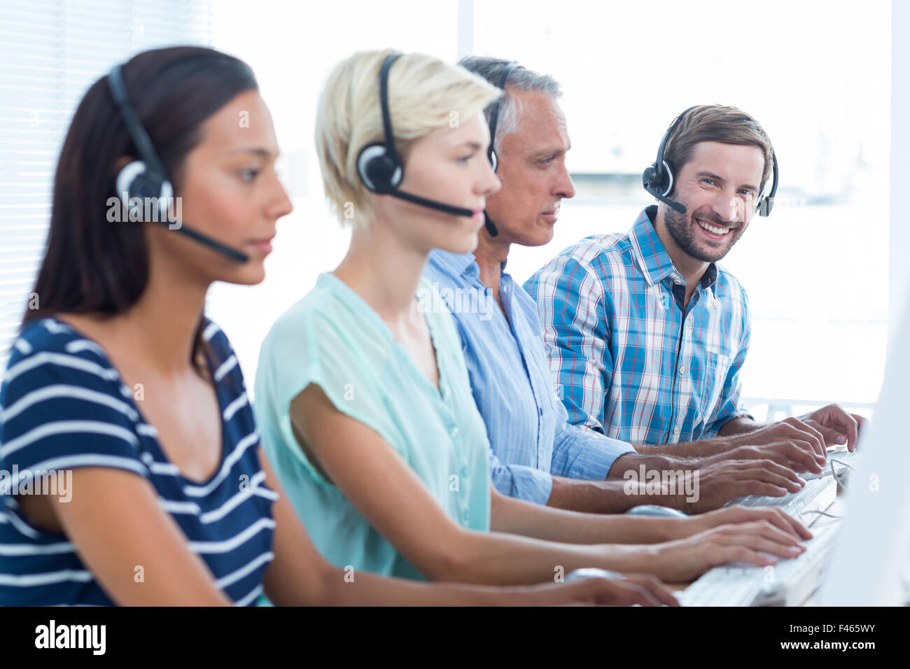 Casual call centre workers in the office Stock Photo - Alamy