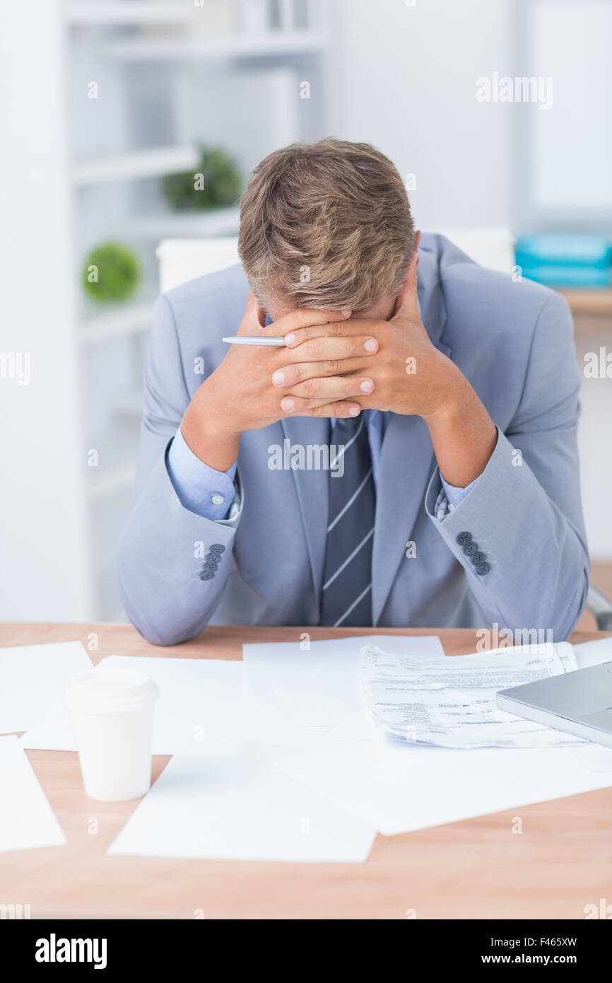 Businessman being depressed by working Stock Photo - Alamy