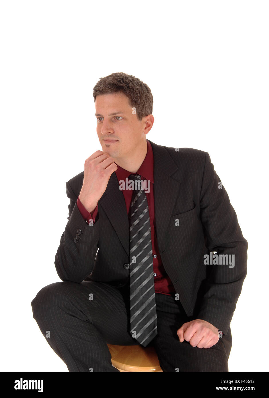 Young businessman sitting thinking hi-res stock photography and images ...