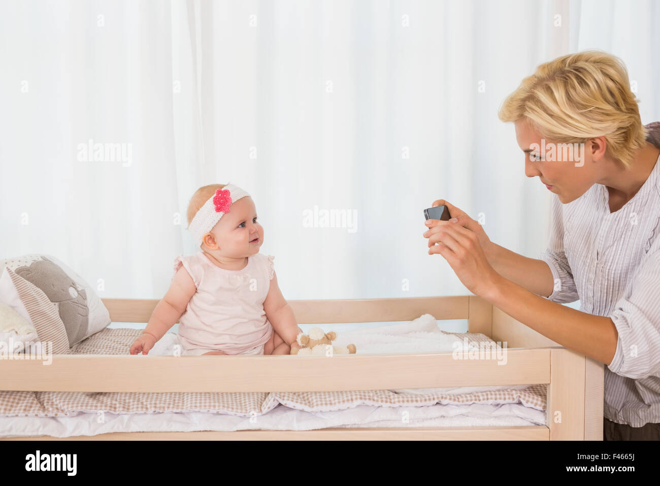 Woman interacting baby toy hi-res stock photography and images - Alamy
