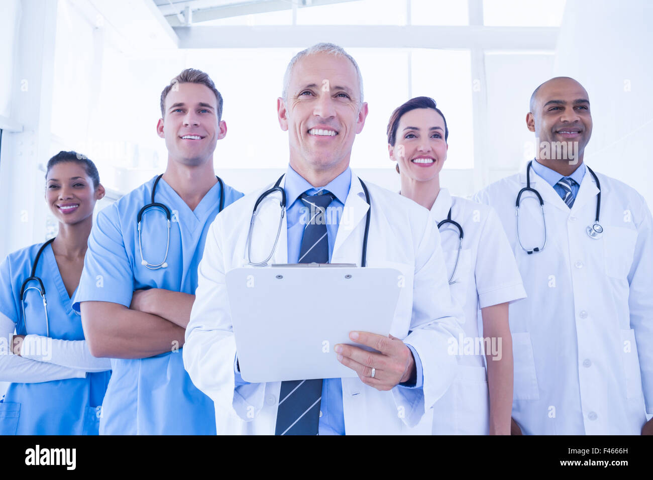 Team of smiling doctors looking at camera Stock Photo - Alamy