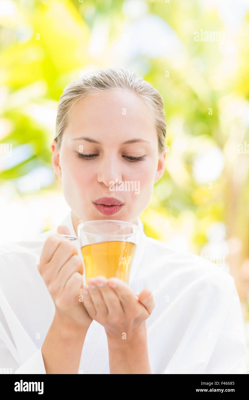 Attractive woman drinking tea Stock Photo - Alamy