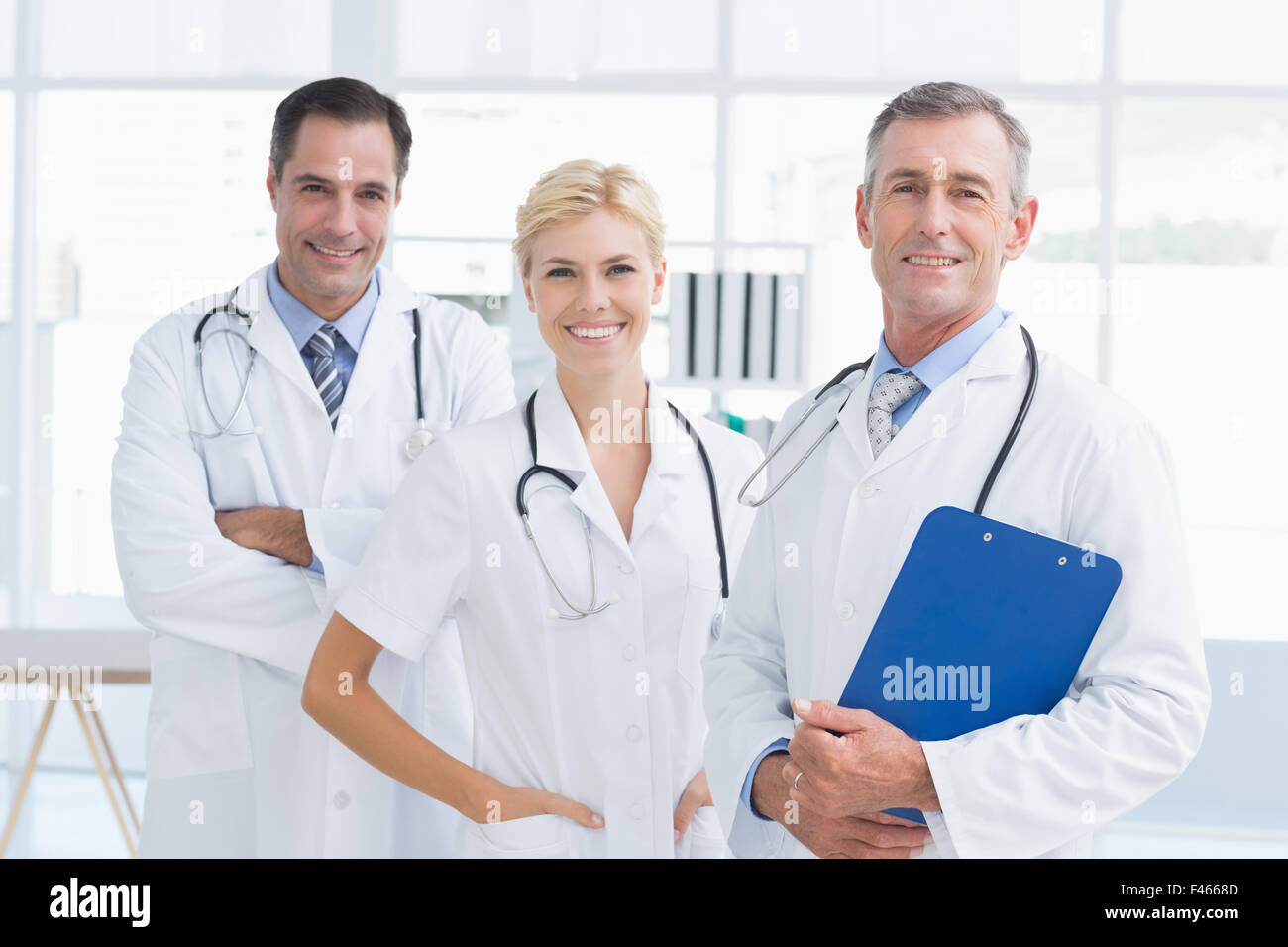 Doctors smiling at camera Stock Photo - Alamy