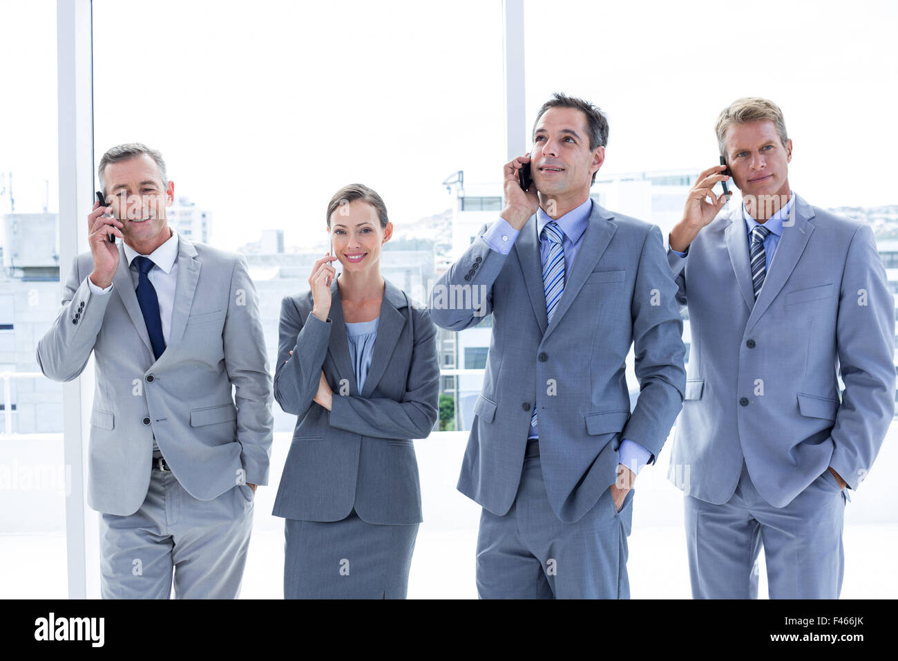 Employees using their mobile phone Stock Photo - Alamy