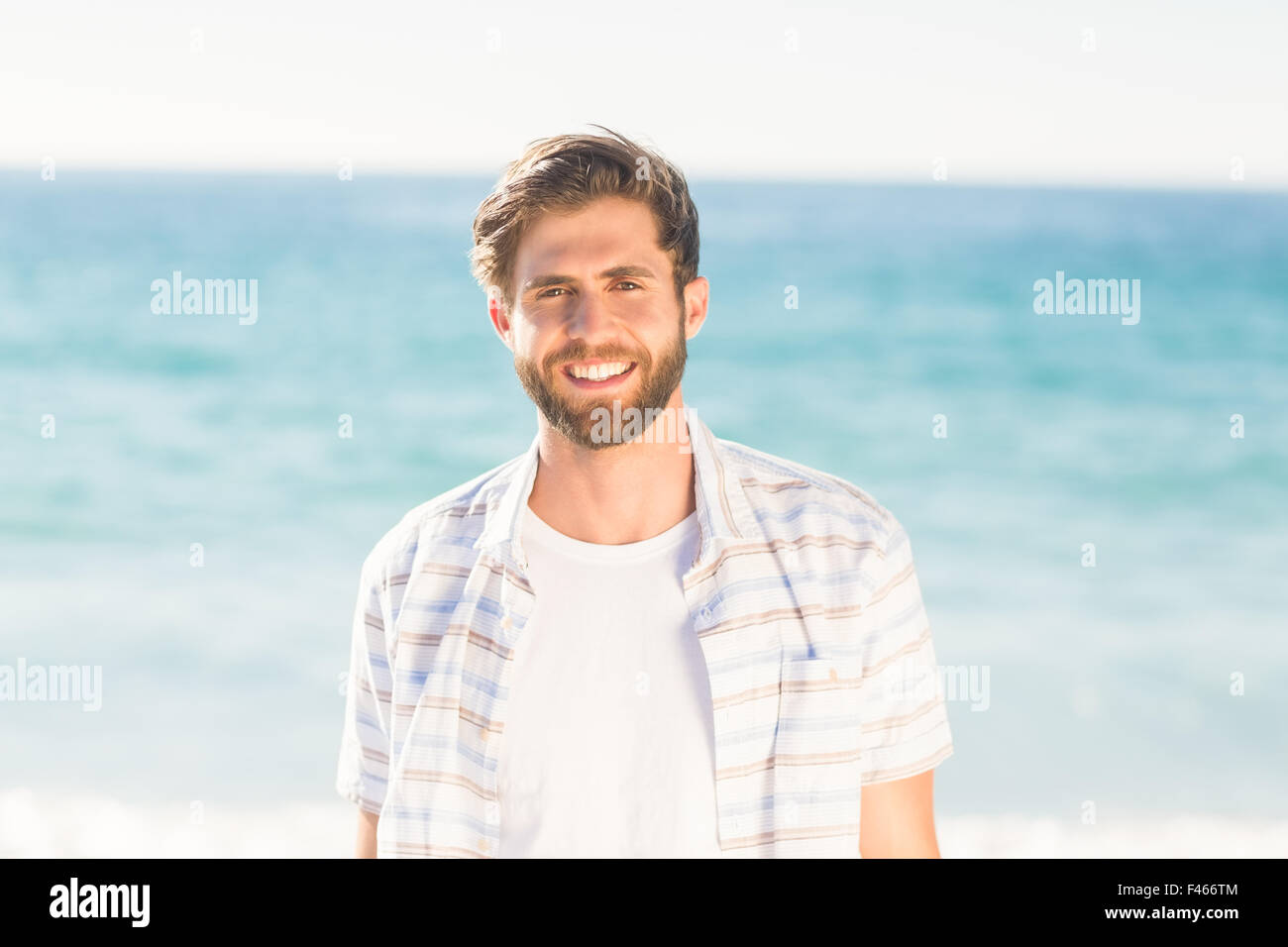 Handsome man looking at camera Stock Photo - Alamy