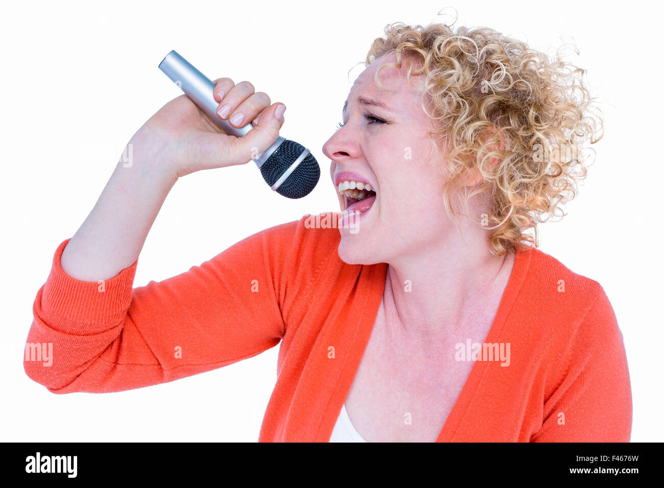 Beautiful blonde woman singer microphone hi-res stock photography and ...