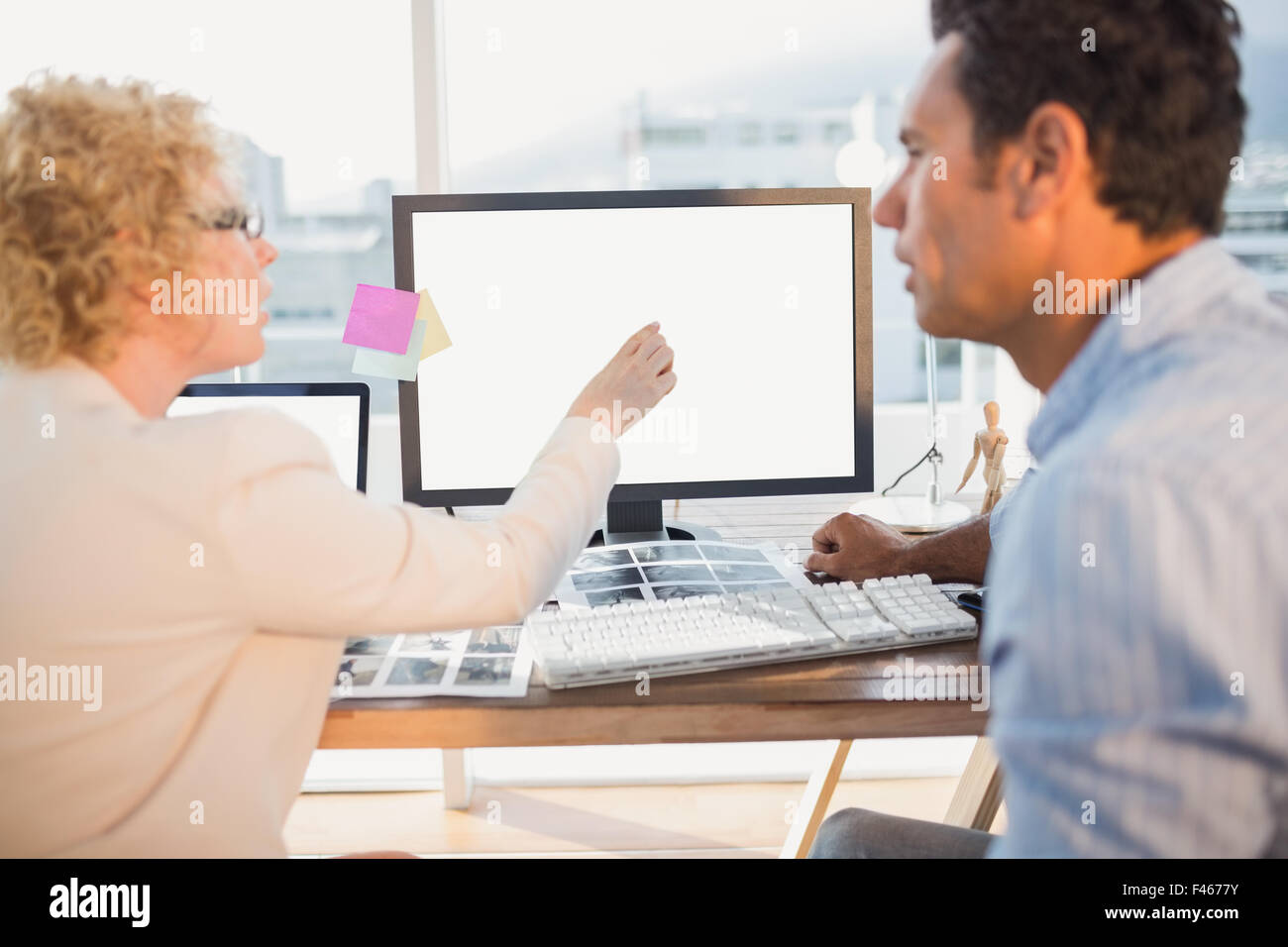 Smiling casual business team working together Stock Photo - Alamy Smiling casual business team working together Stock Photo - Alamy