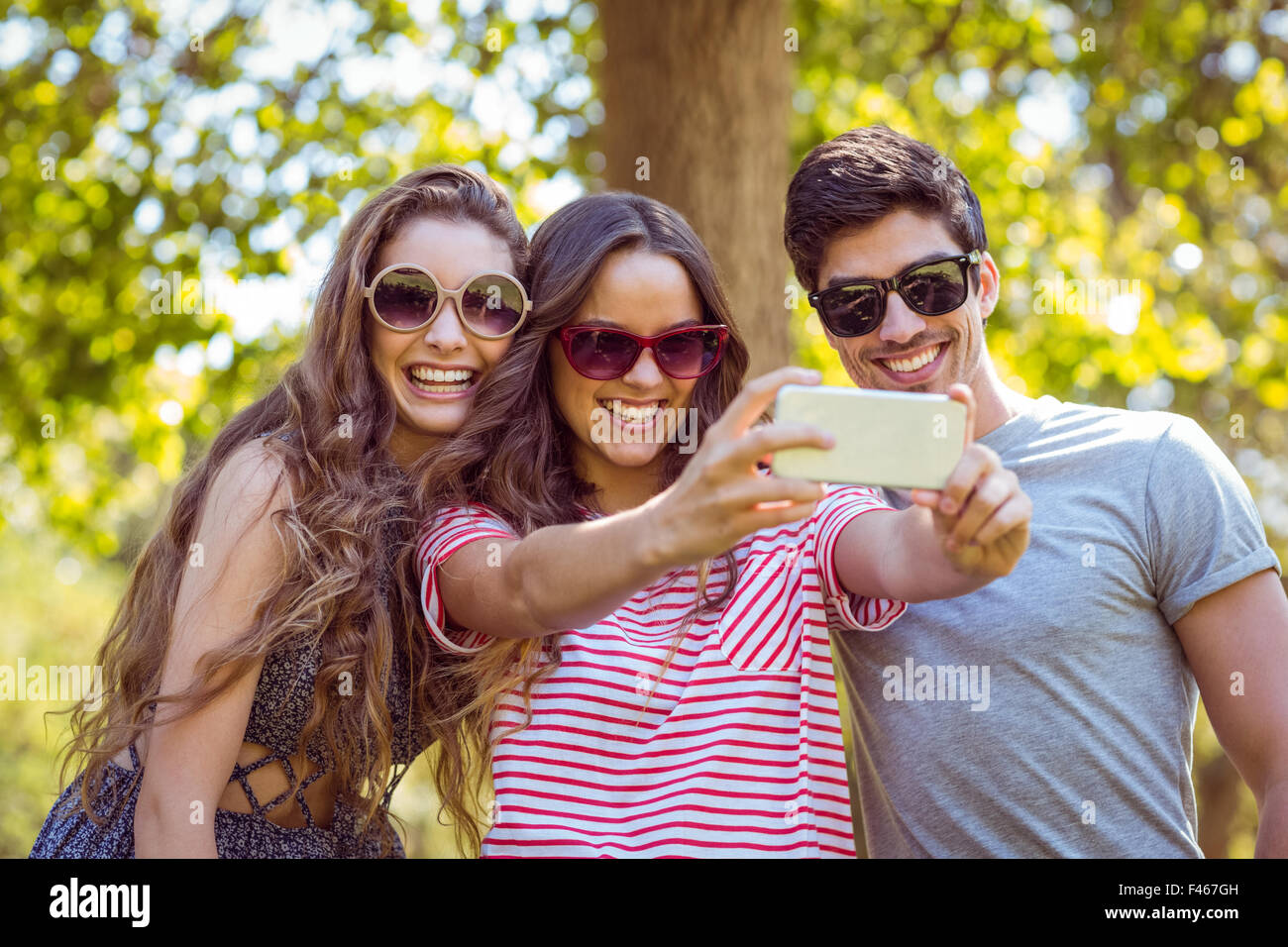 Happy friends taking a selfie Stock Photo - Alamy