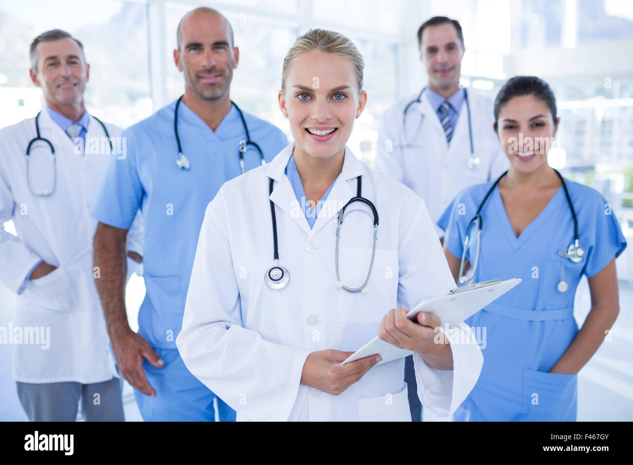 Team of smiling doctors looking at camera Stock Photo - Alamy