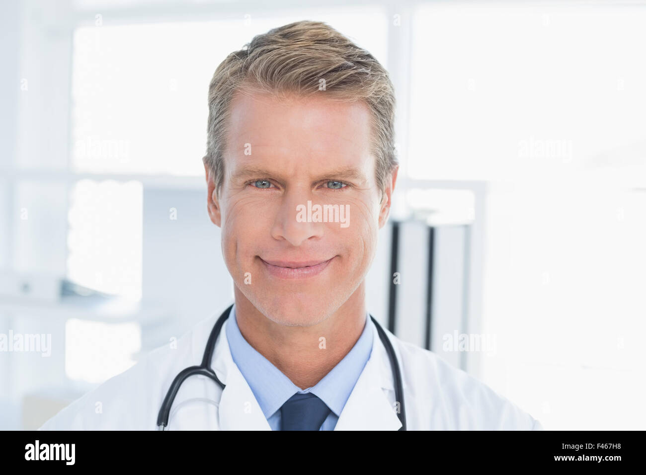 Smiling doctor looking at camera Stock Photo - Alamy