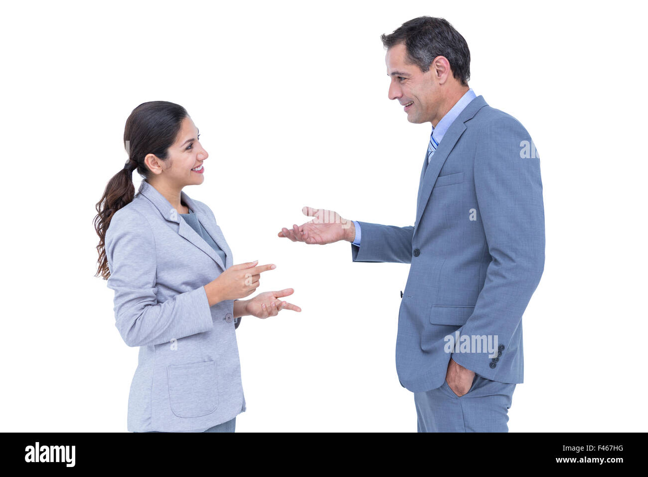 Confident business people smiling Stock Photo - Alamy